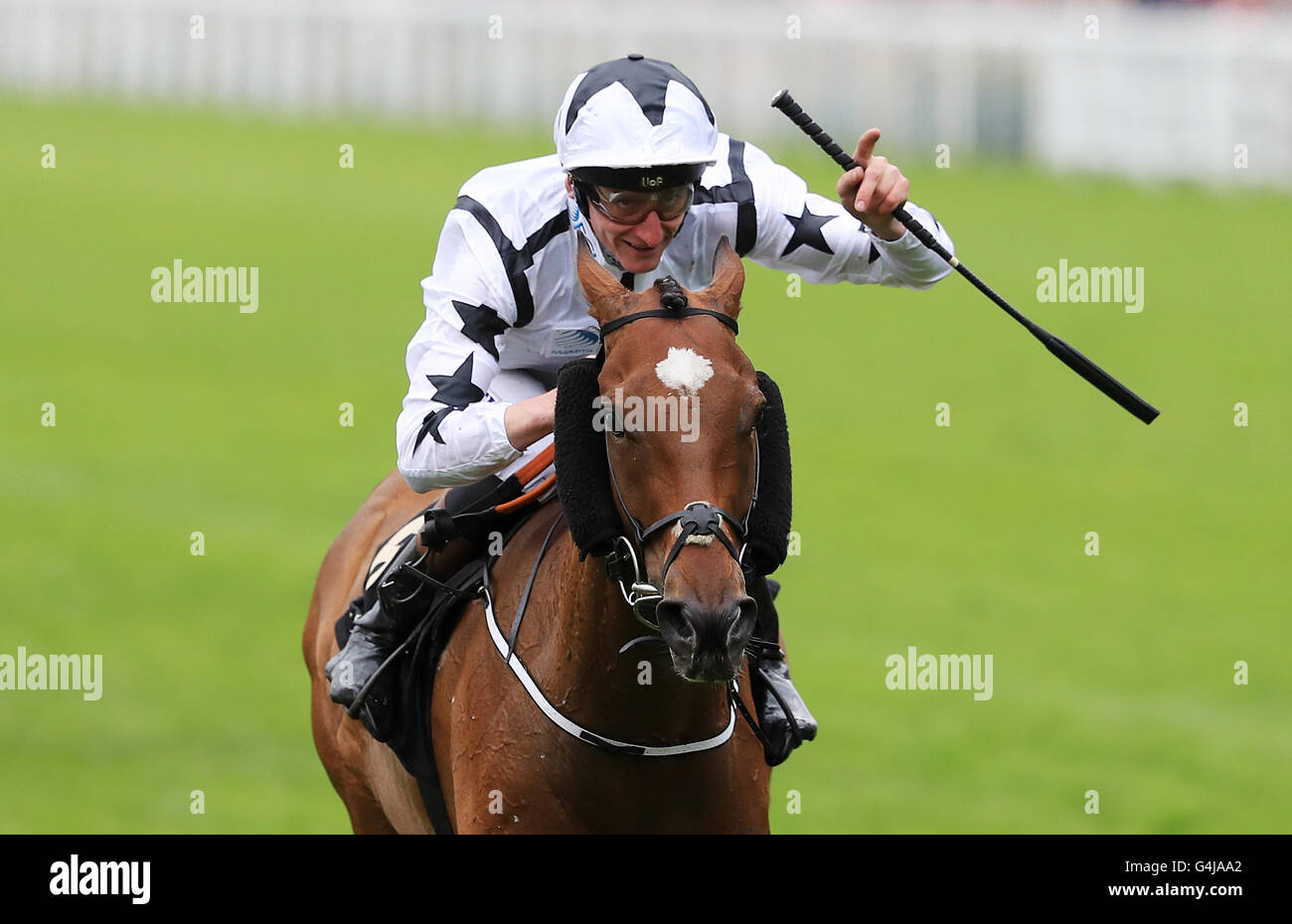 Adam Kirby celebrates his victory on Commissioned in the Queen ...