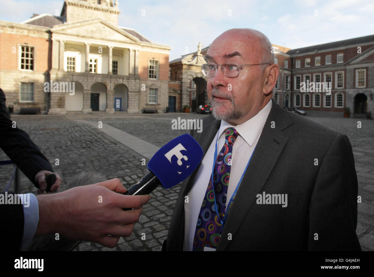Education Minister Ruairi Quinn speaks to the media as he arrives for ...