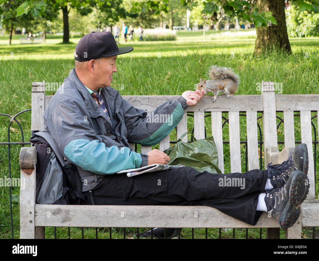 Old man and squirrel hi-res stock photography and images - Alamy