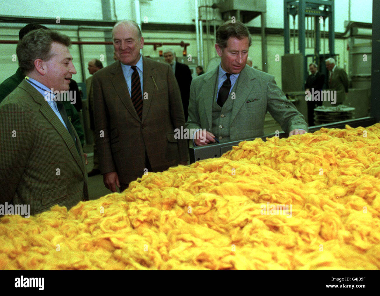 The Prince Of Wales (R) during a tour of a new factory of weavers ...