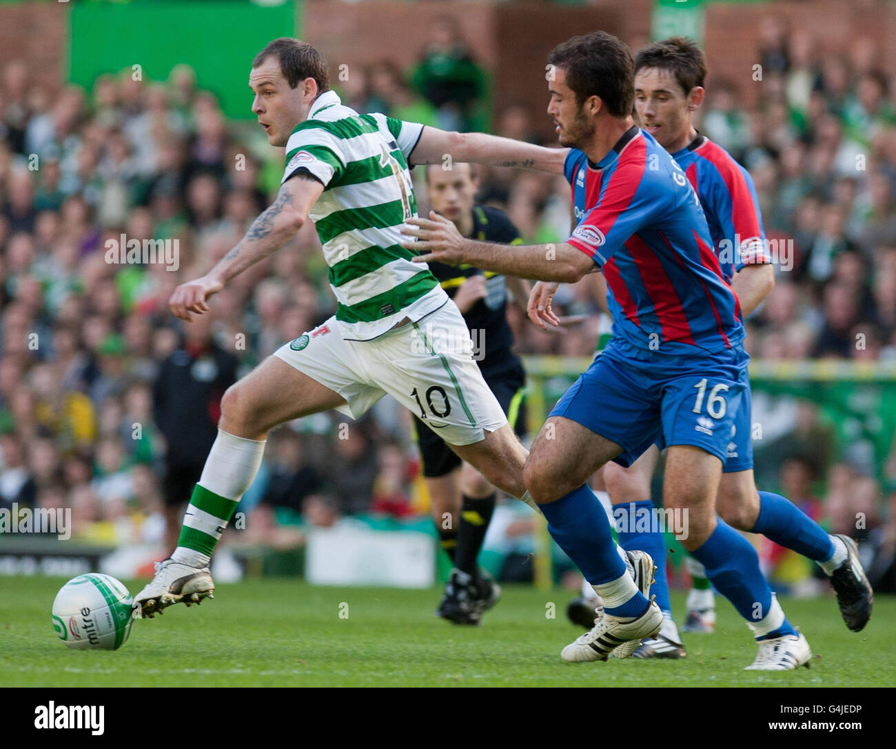 Celtic's Anthony Stokes (left) away from Inverness's Roman Golobart and ...
