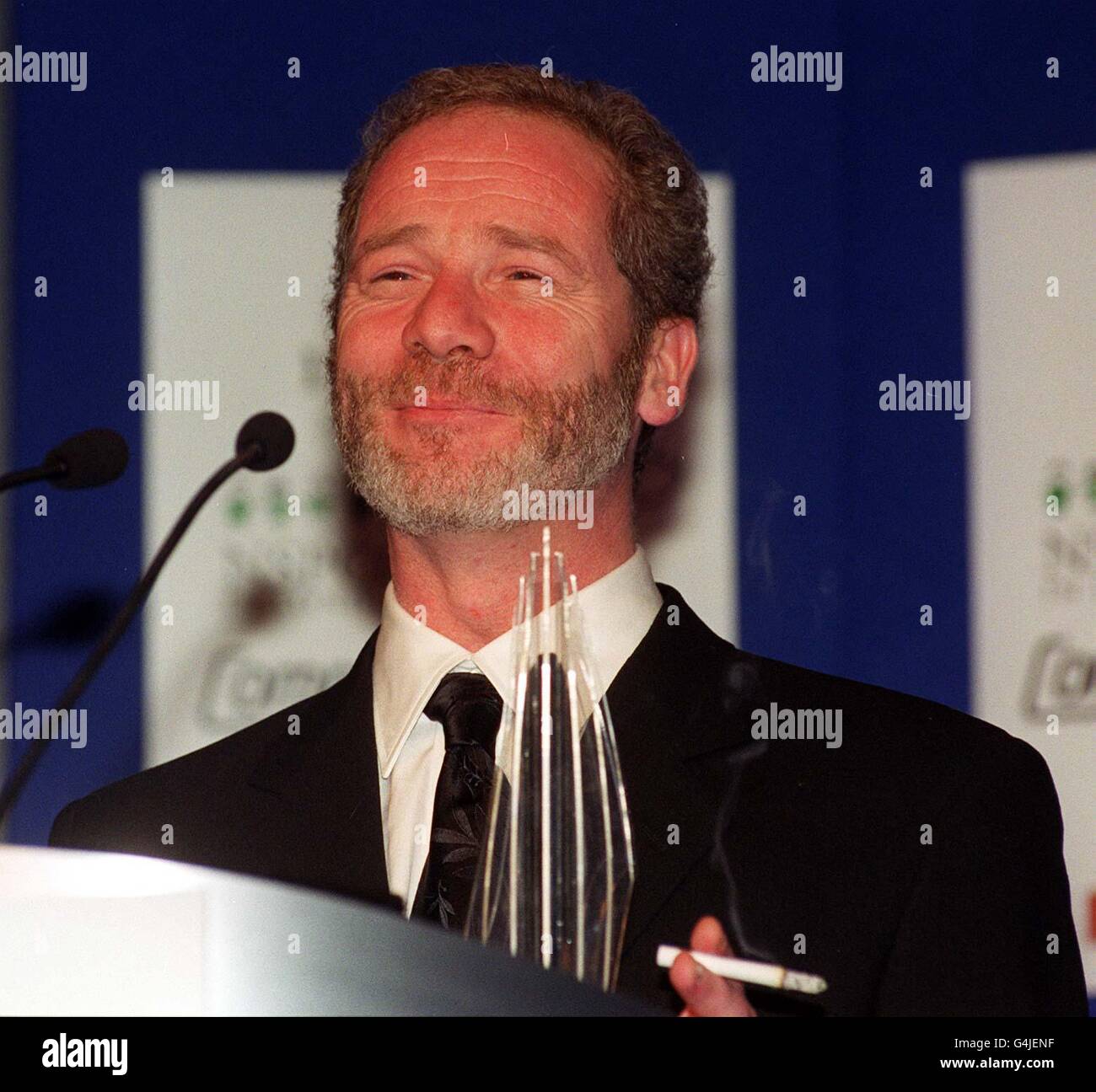 Head shoulders landscape semi profile beard smiling holding cigarette ...