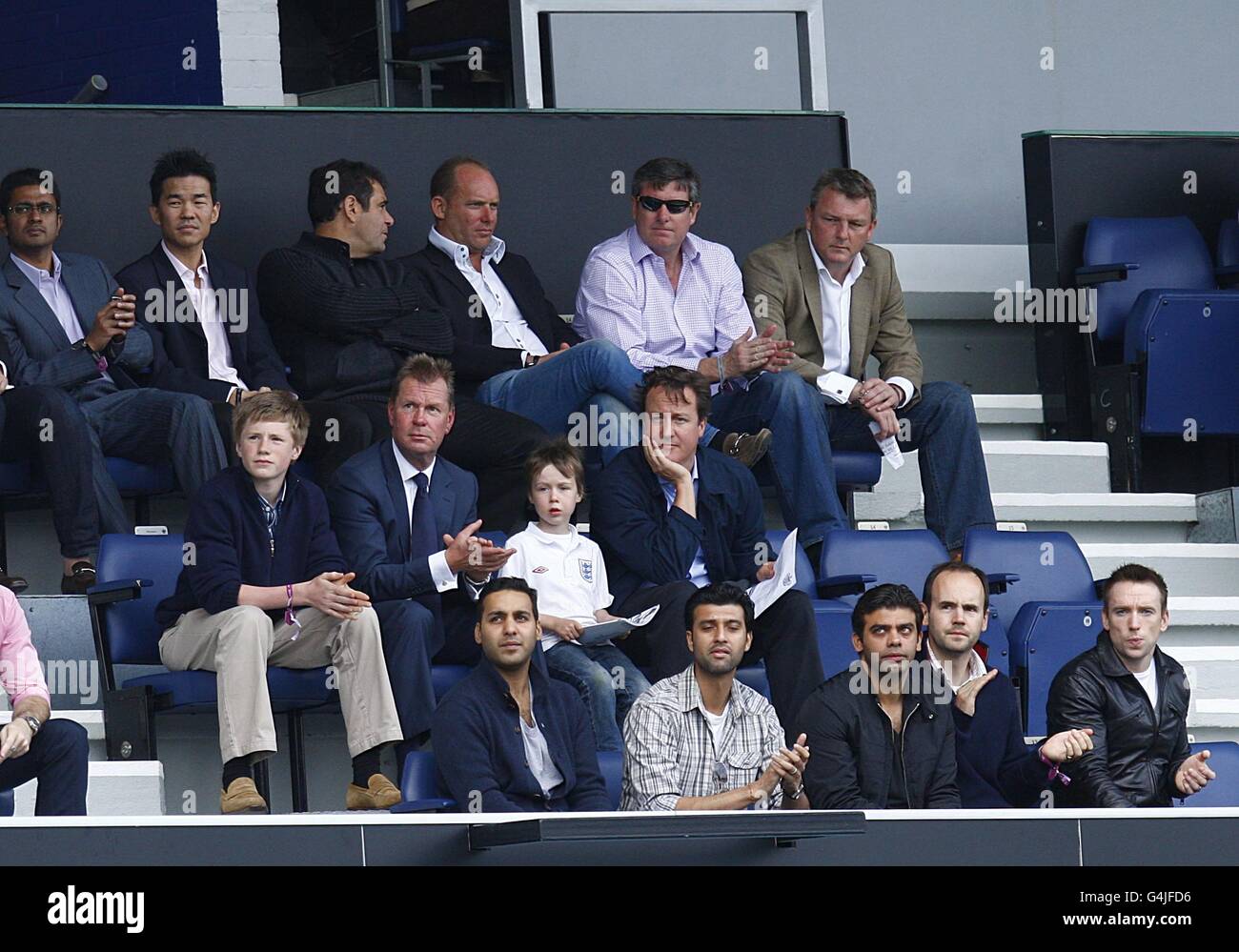 Prime Minister David Cameron (centre) sits with his son Arthur as he ...