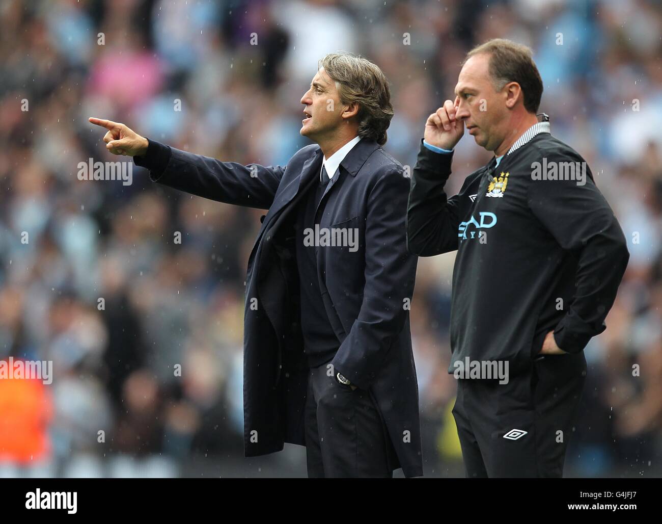 Manchester City Manager Roberto Mancini (left) and First Team Coach ...
