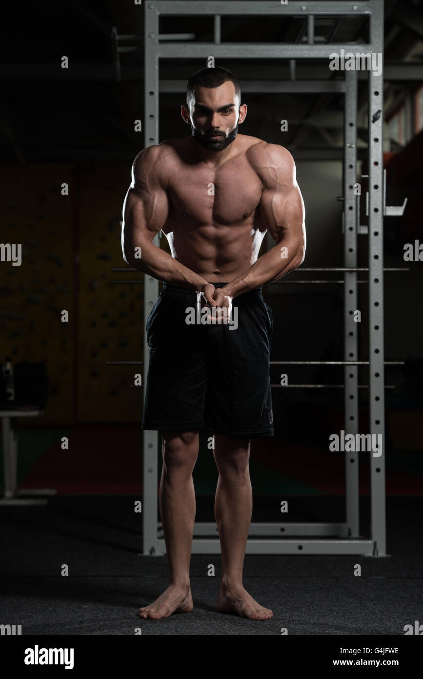 Portrait Of A Young Physically Fit Man Making Most Muscular Pose ...