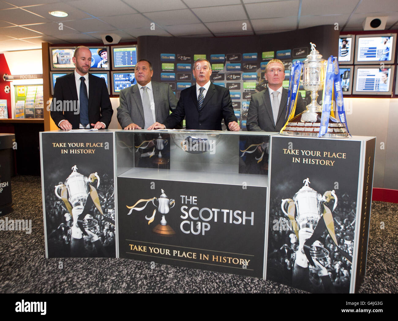Scottish FA President Campbell Ogilvie (right of centre) is joined by ...