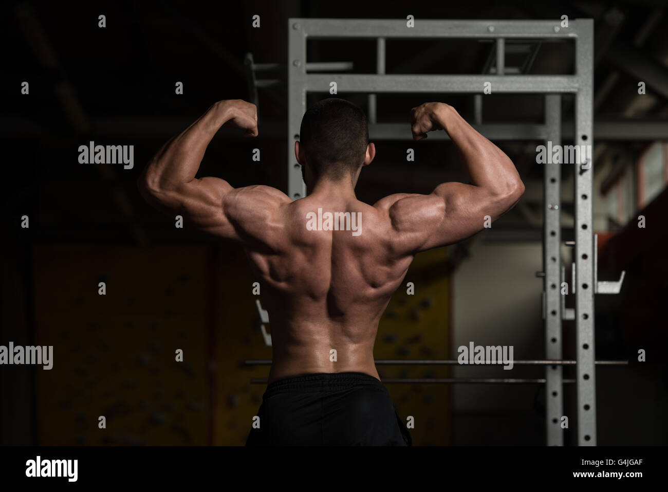 Double biceps pose young attractive hi-res stock photography and images ...