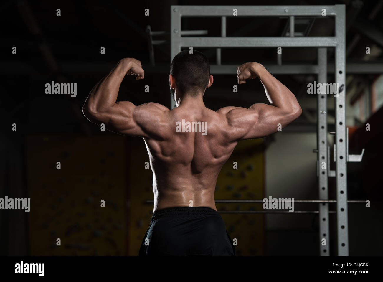 Double biceps pose young attractive hi-res stock photography and images ...