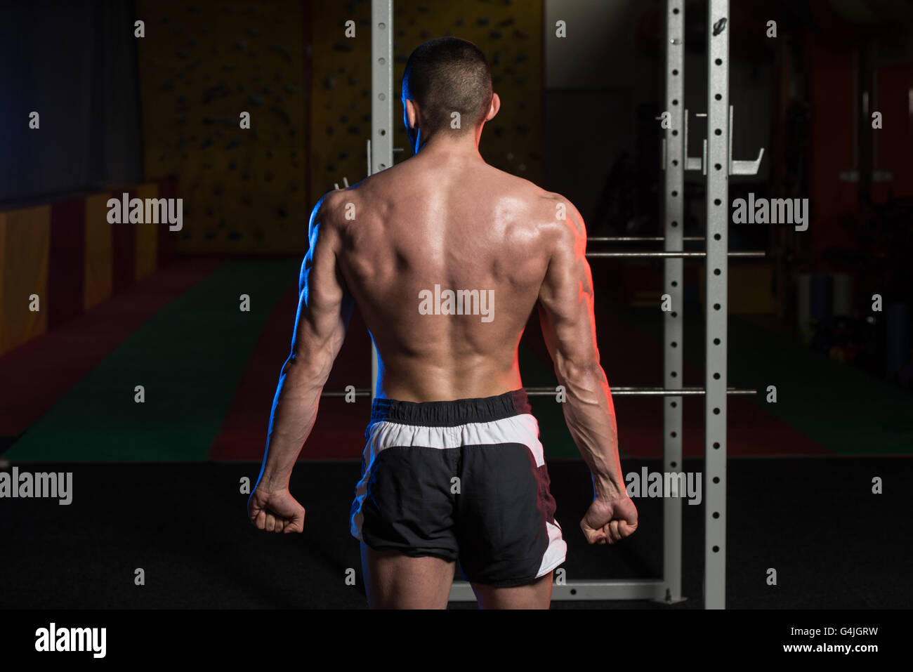 Portrait Of A Young Fit Man Showing Side Triceps Pose - Muscular ...