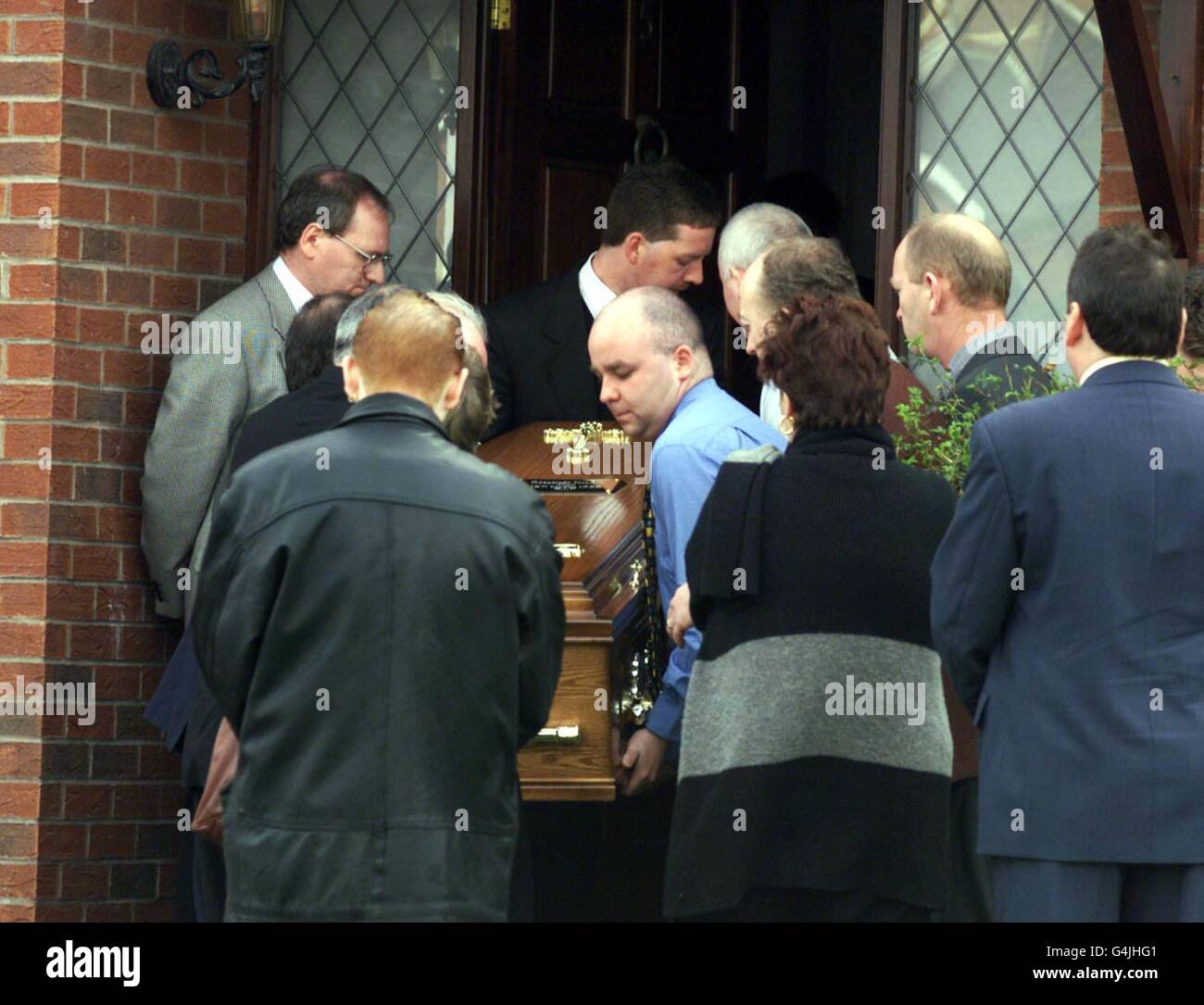 The body of Rosemary Nelson is carried by family back into her home in ...