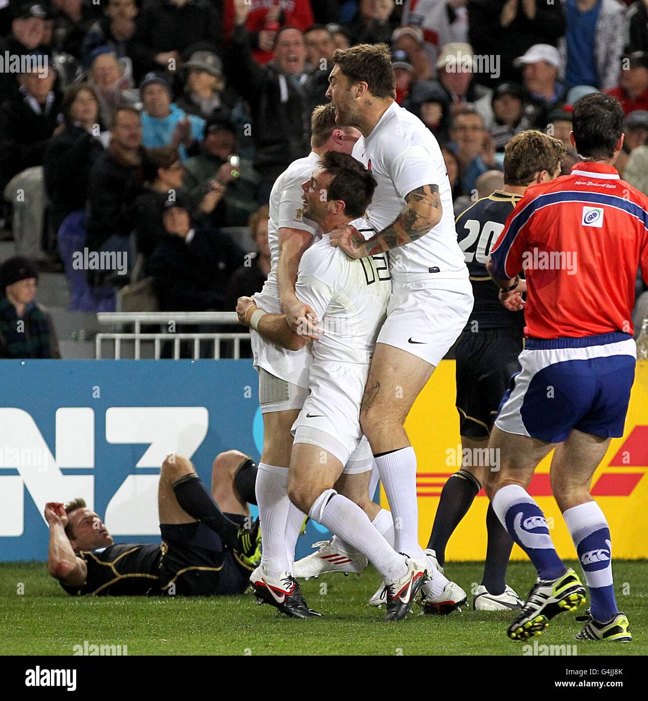 England players celebrate after Chris Ashton goes over to score the ...
