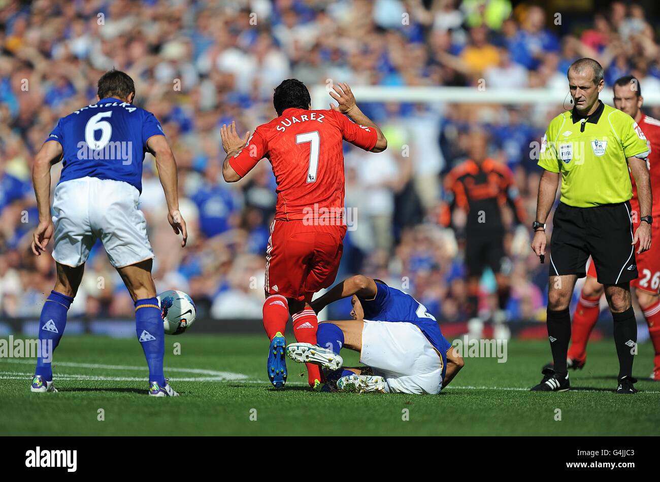 Referee Martin Atkinson (right) watches as Everton's Jack Rodwell ...