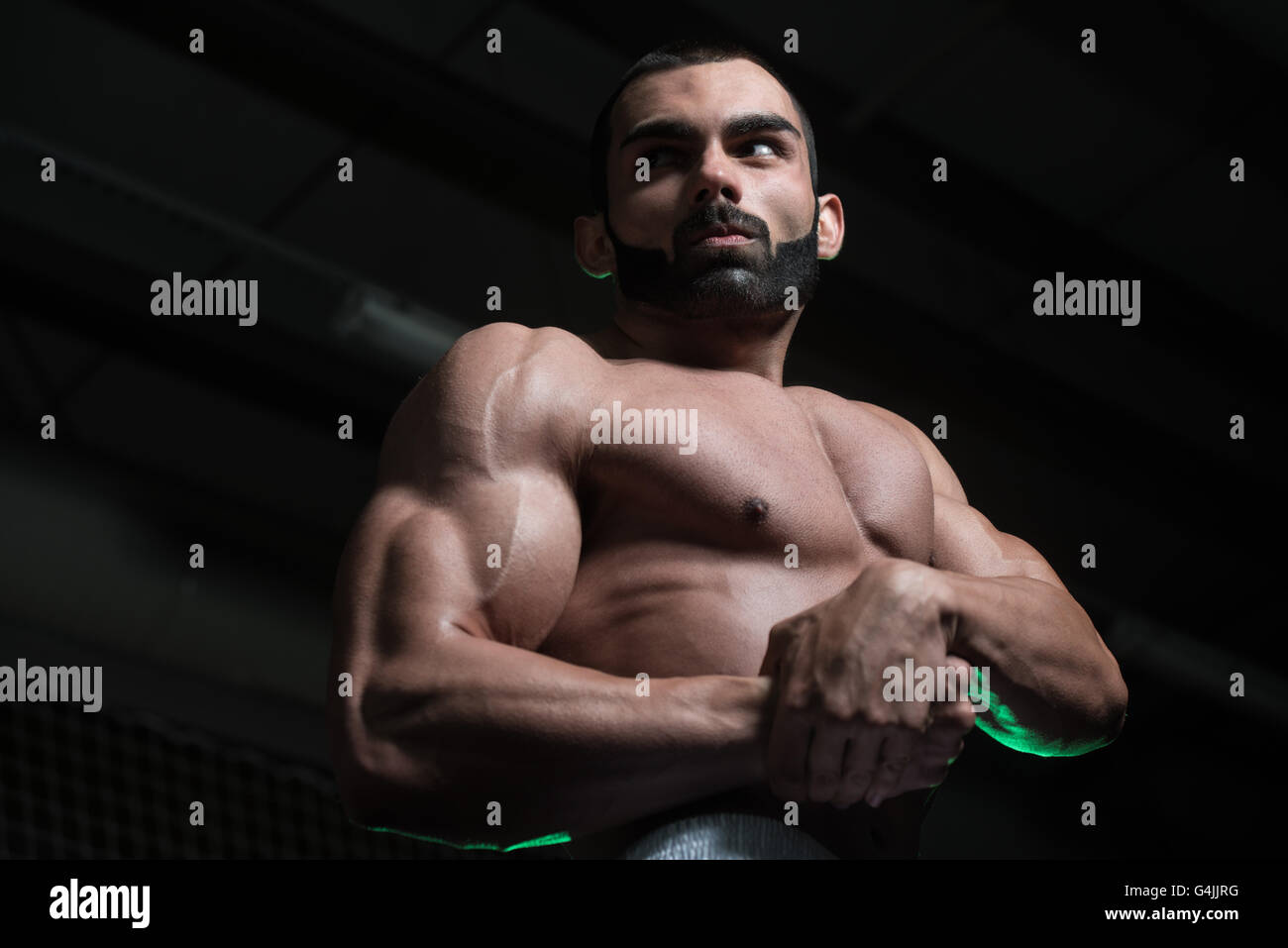 Portrait Of A Young Physically Fit Man Performing Side Chest Pose ...