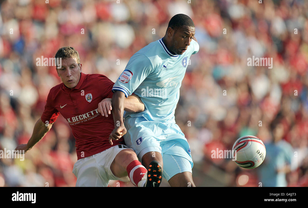 Coventry City's Clive Platt gets the better of Barnsley's Jim McNulty ...