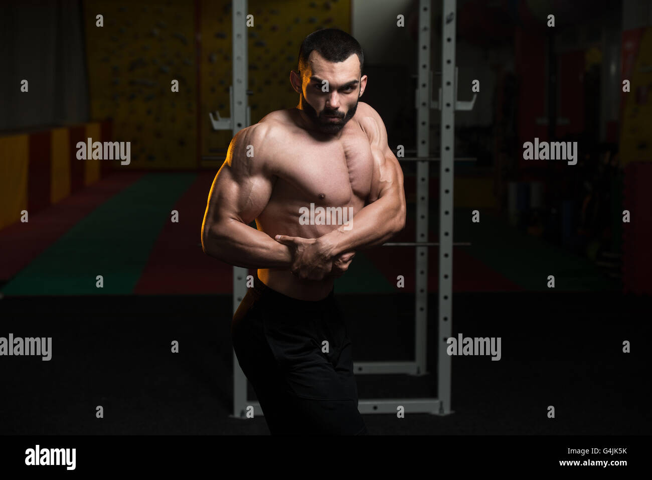 Portrait Of A Young Physically Fit Man Performing Side Chest Pose ...