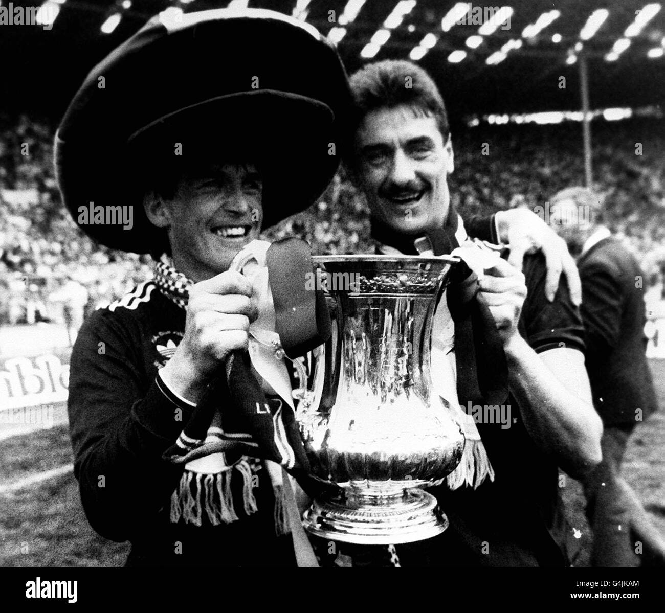 1 2 half length portrait hat holding trophy smiling happy sport hi-res ...