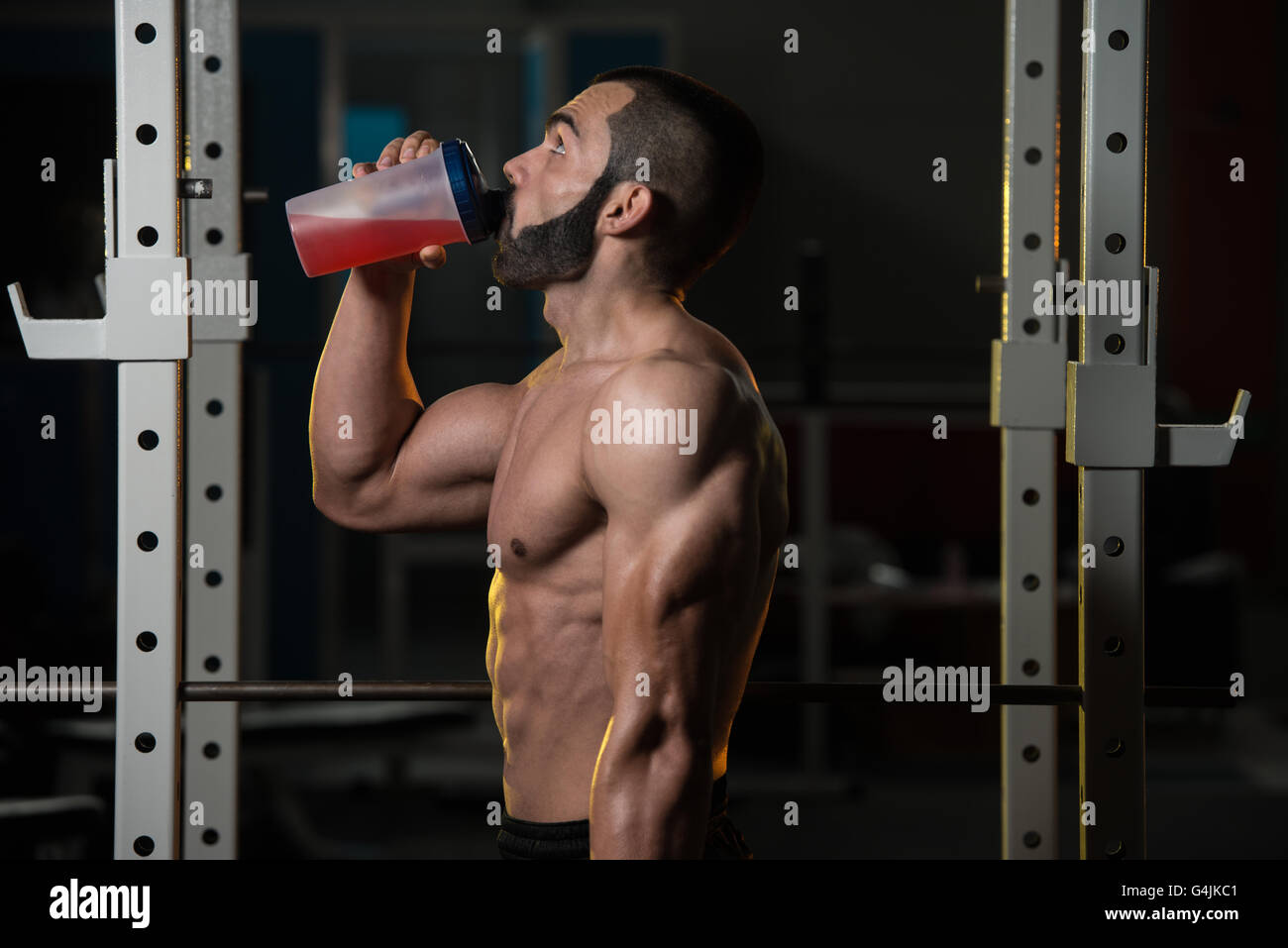 Muscular Man Resting After Exercise And Drinking From Shaker Stock ...