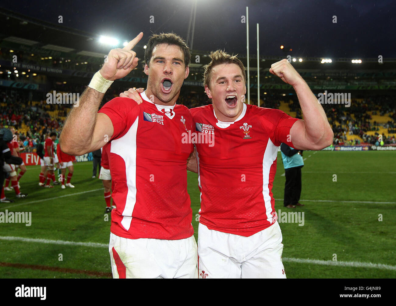 Wales' Mike Phillips and Jonathan Davies (right) celebrate victory ...
