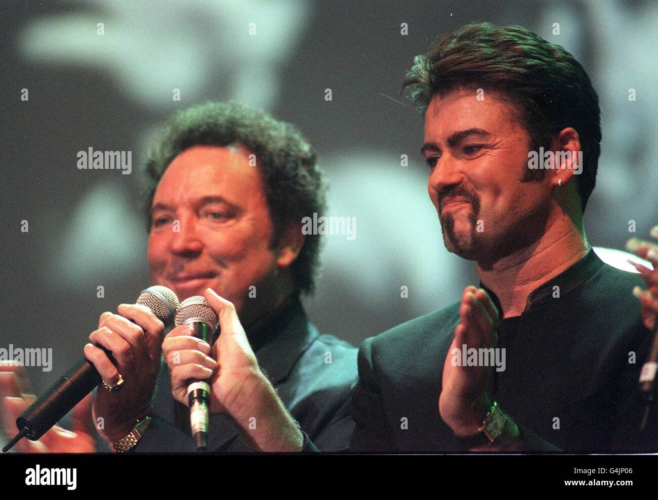 Tom Jones and George Michael perform a duet during a tribute concert to ...