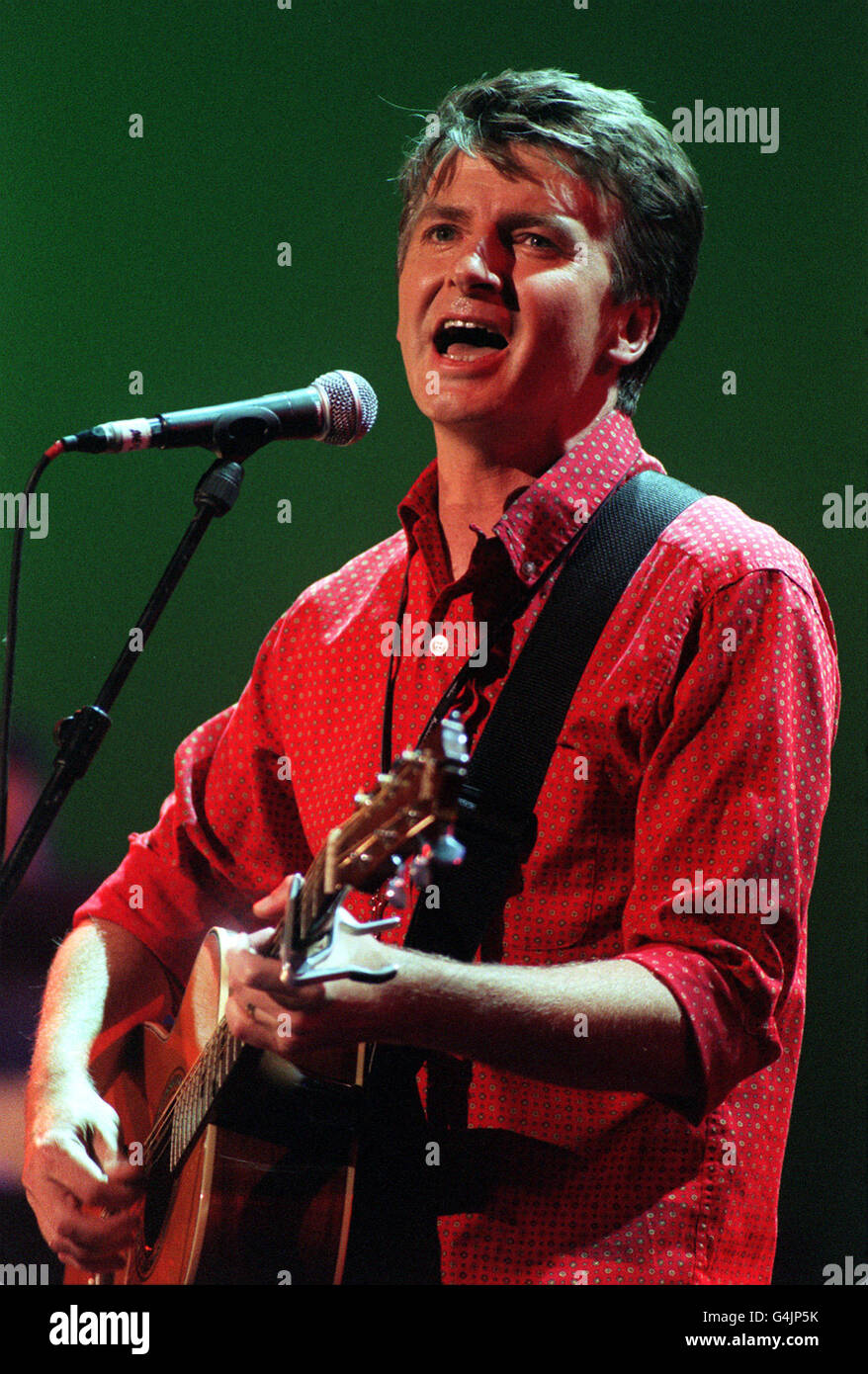 Neil Finn, formerly of Crowded House, performs during 'Here There and ... Neil Finn, formerly of Crowded House, performs during 'Here There and ...