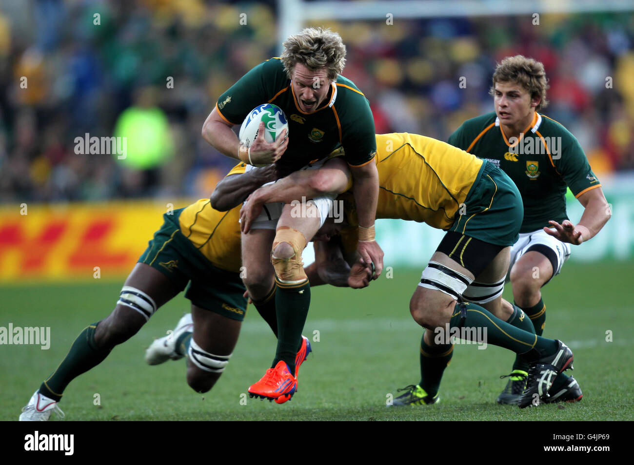 South Africa's Jean De Villiers is tackled by Australia's Radike Samo ...
