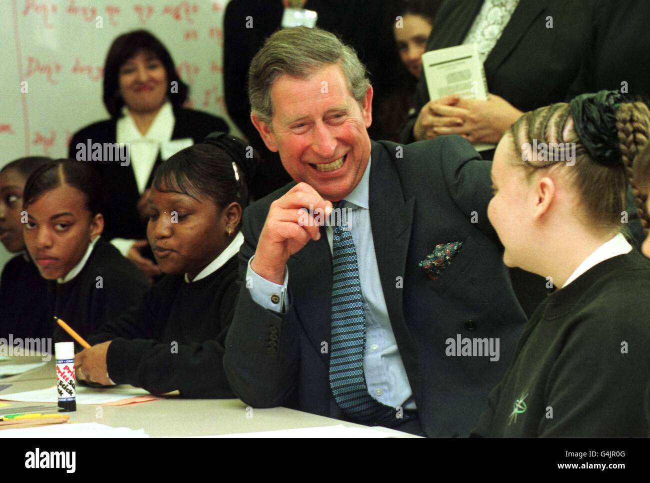The Prince of Wales shares a joke with Louisa Nevin in a poetry class ...