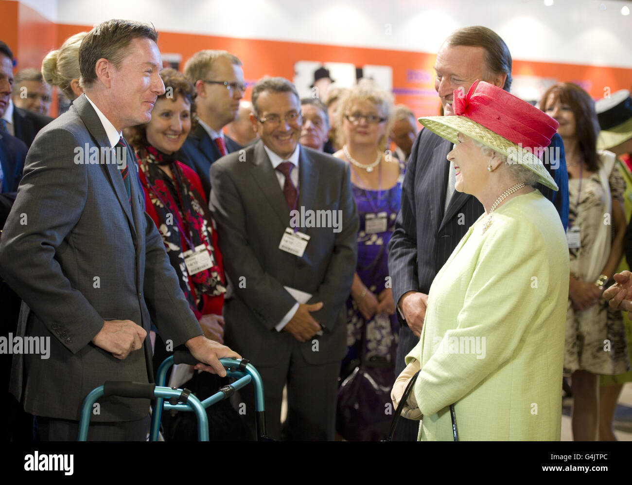 Queen Elizabeth II (right) meets Frank Gardner OBE (left) at ...