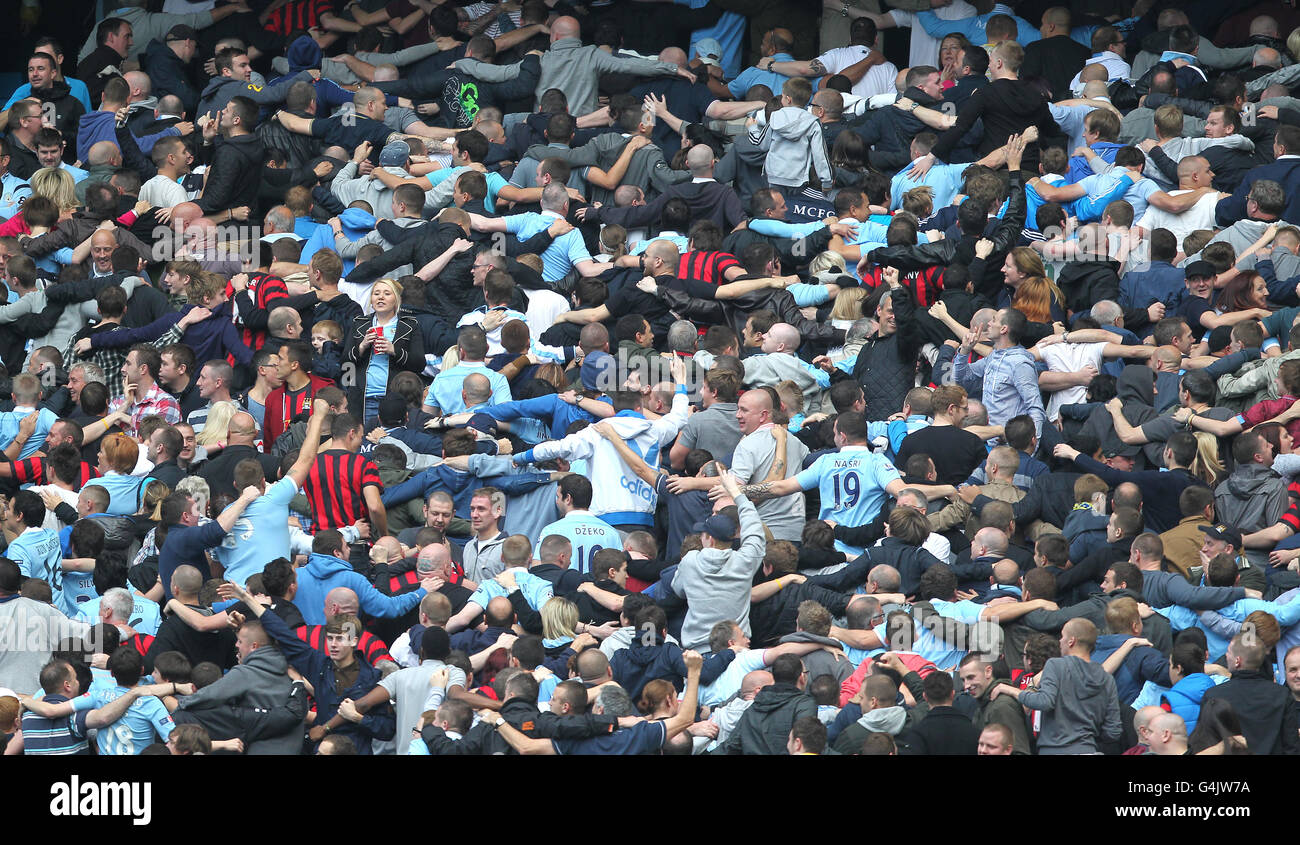 Manchester city fans celebrate by doing the poznan hi-res stock ...