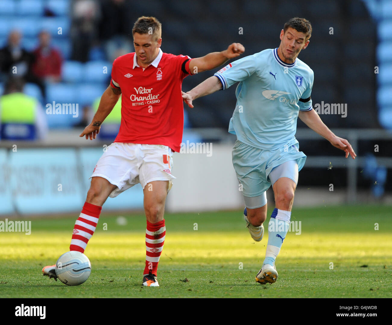 Coventry City's Lukas Jutkiewicz and Nottingham Forest's Luke Chambers ...