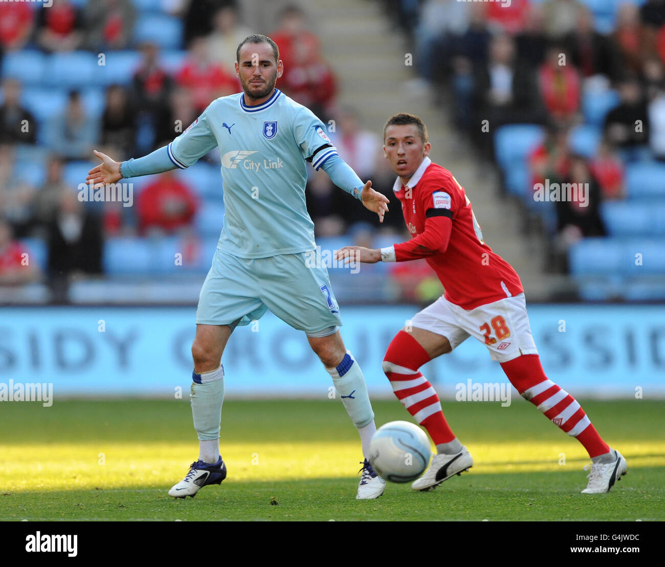 Coventry City's David Bell and Nottingham Forest's Radoslaw Majewski ...