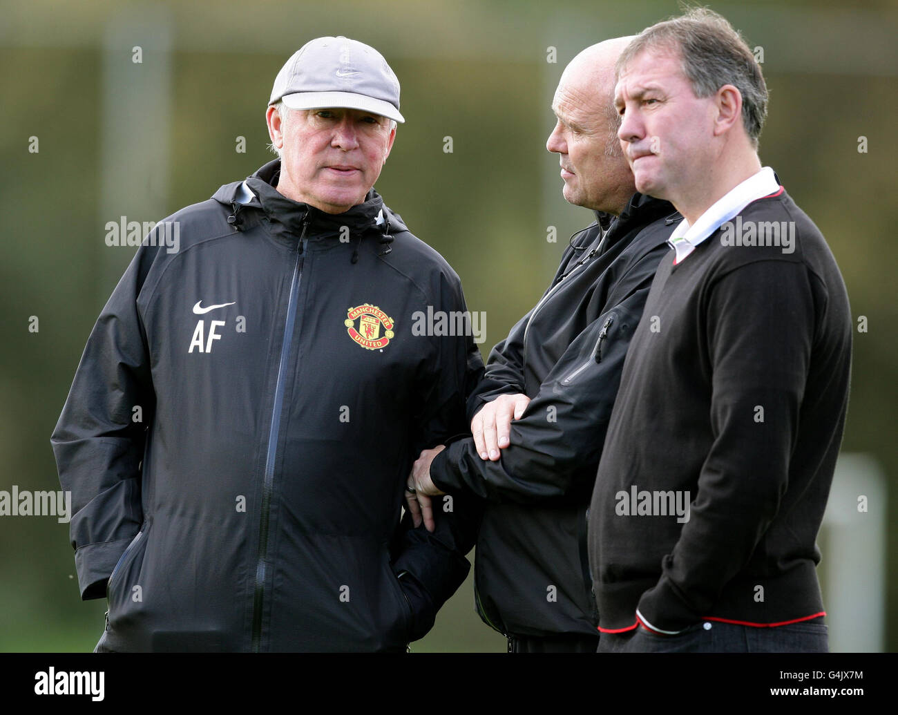 Manchester United's manager Sir Alex Ferguson (left) talks to assistant ...