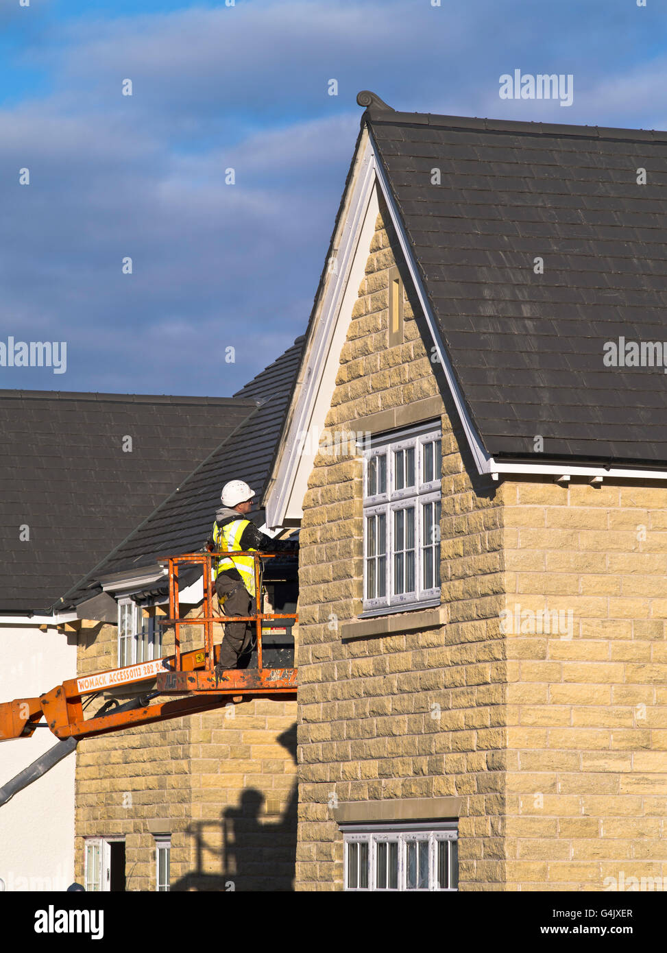 dh New house REDROW HOMES UK Construction site building worker workman ...