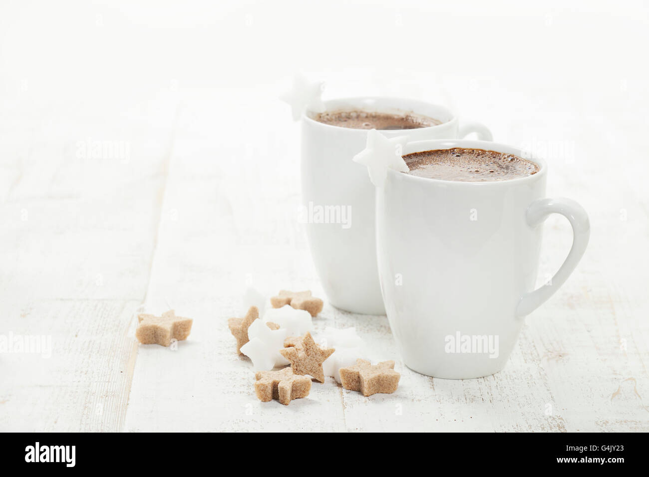 Two coffee cups on white background Stock Photo - Alamy