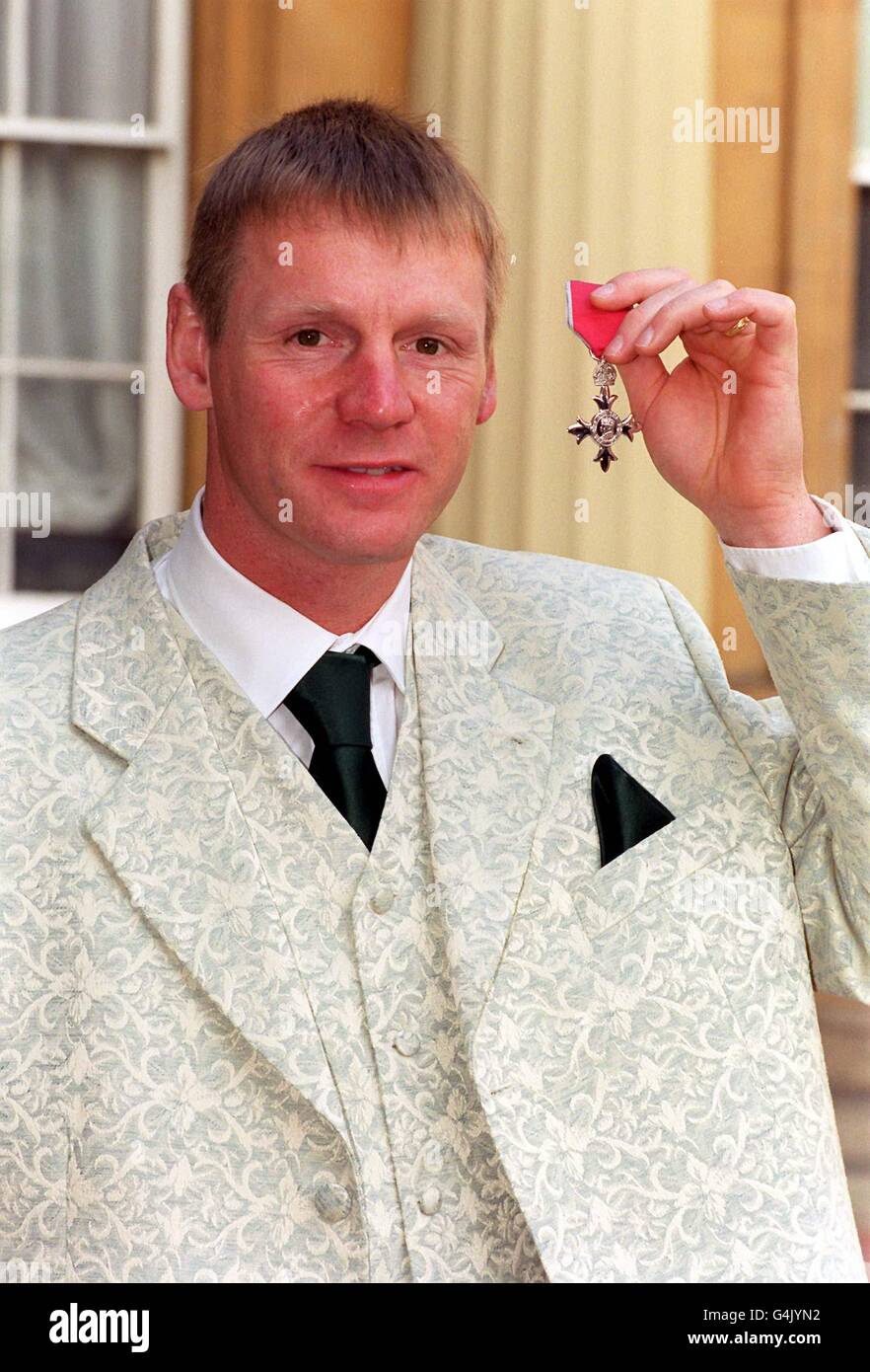 Stuart Pearce holds MBE medal Stock Photo - Alamy