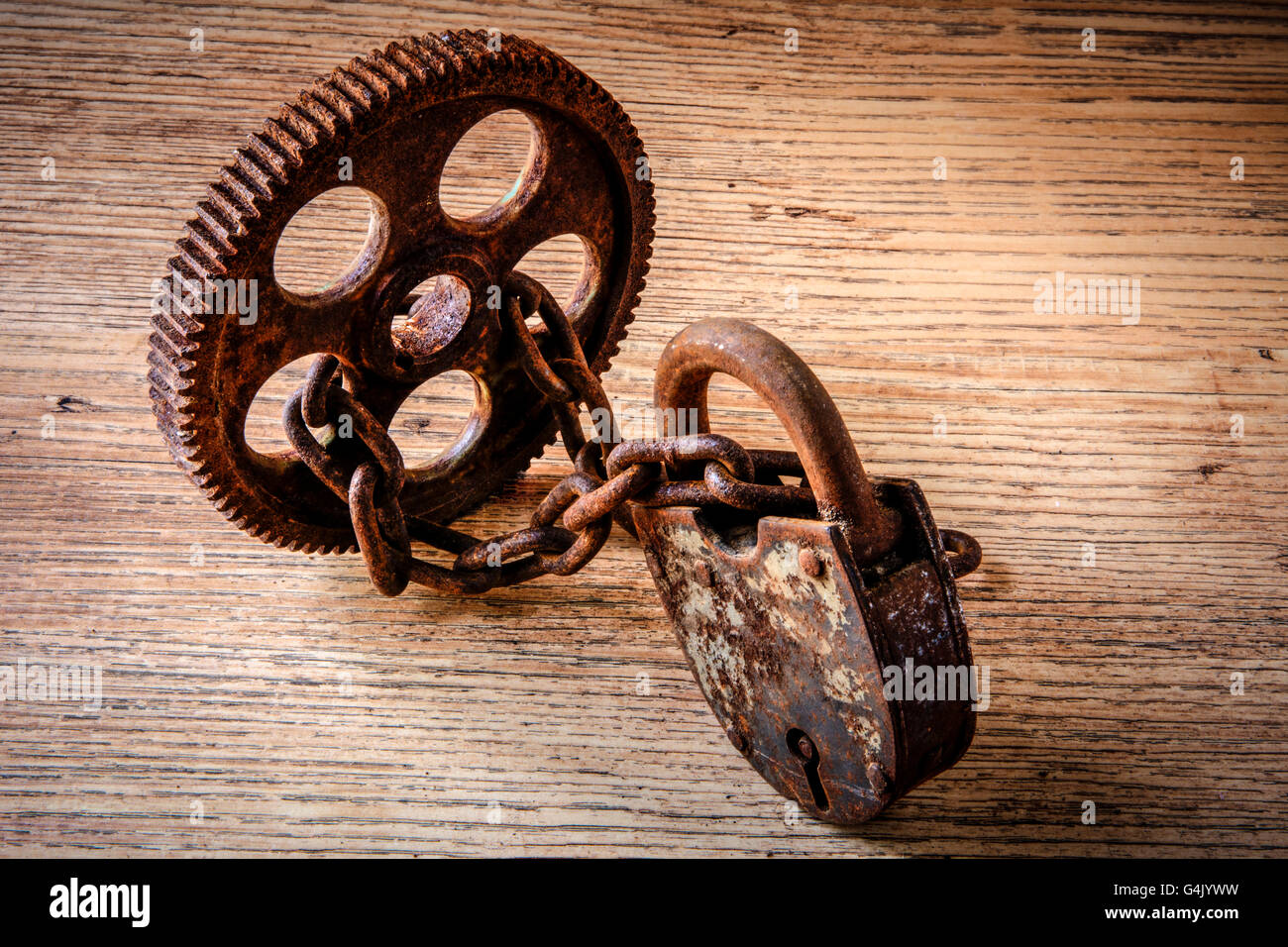 Large rusty chain rusty gear connected to the old, padlock Stock Photo ...