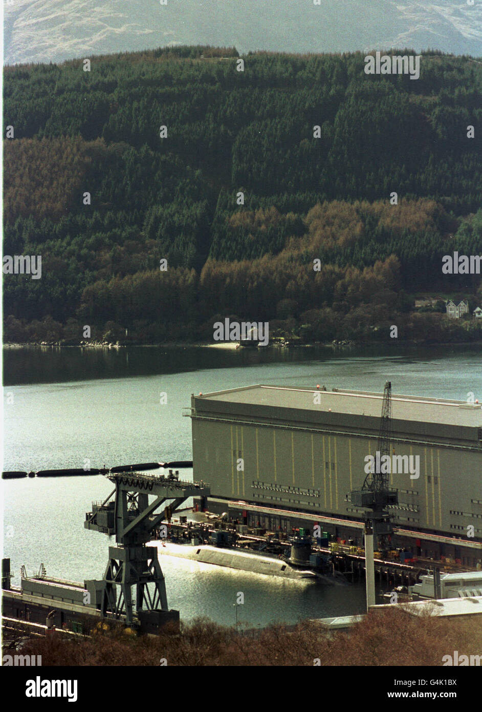 A submarine lies in the dock at HM Naval Base Clyde, home of the First ...