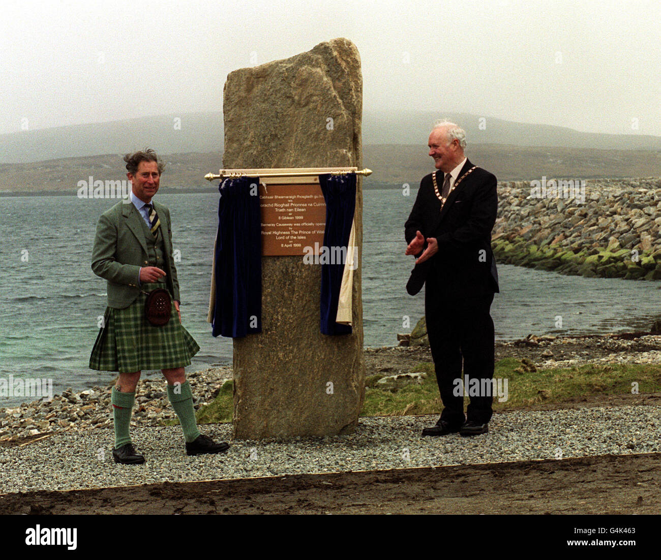 The Prince of Wales unveils a plaque after opening a causeway linking ...