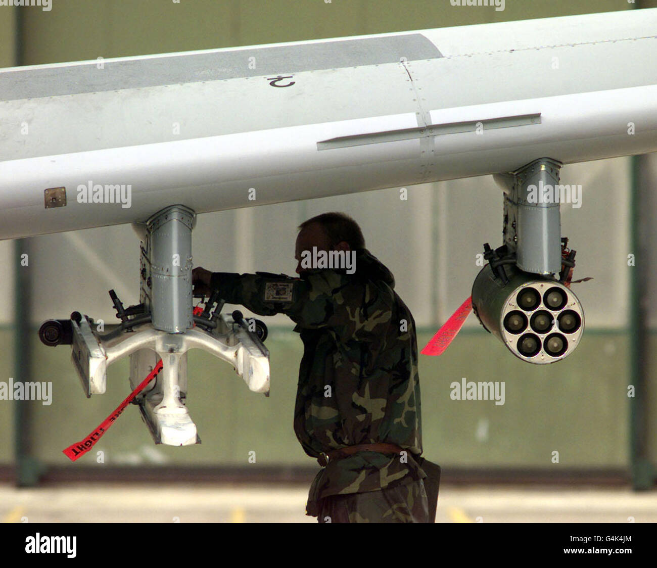 An American airman prepares the weapons carried by A10 Tank buster ...