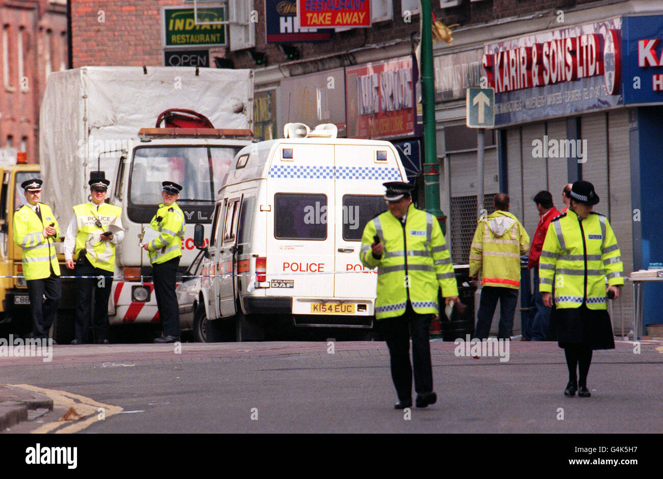Police at the scene where nail bomb exploded in brick lane hi-res stock ...