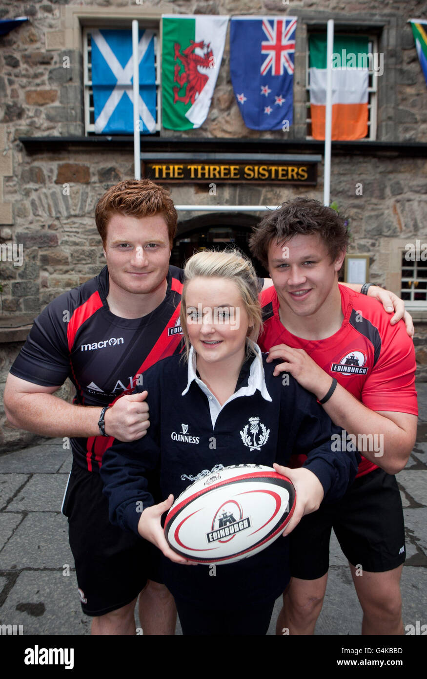 Edinburgh's Kyle Traynor and Alun Walker owith Cara Pitman from "The Three Sisters" pub in ...