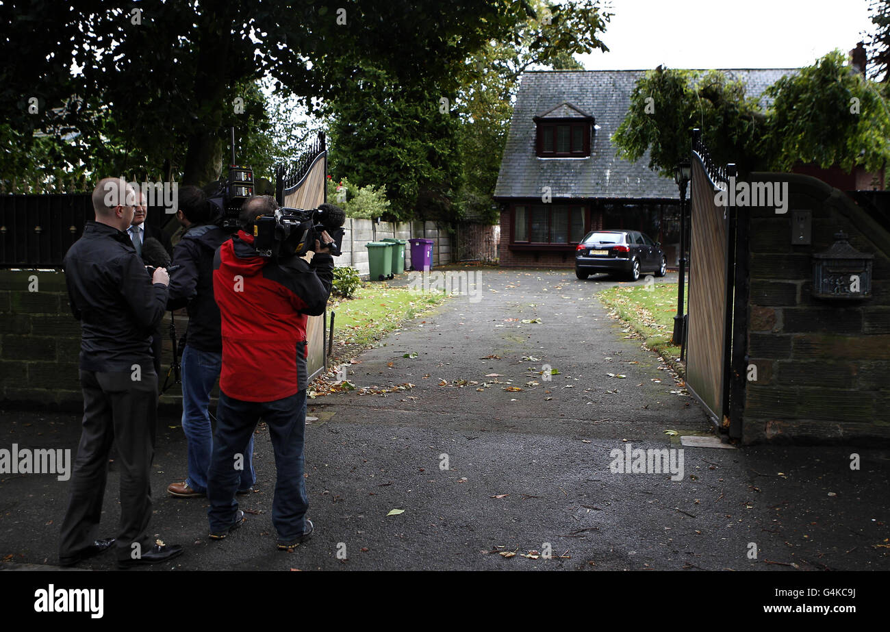 A press pack gather outside the home of Wayne Rooney Sr the father of ...