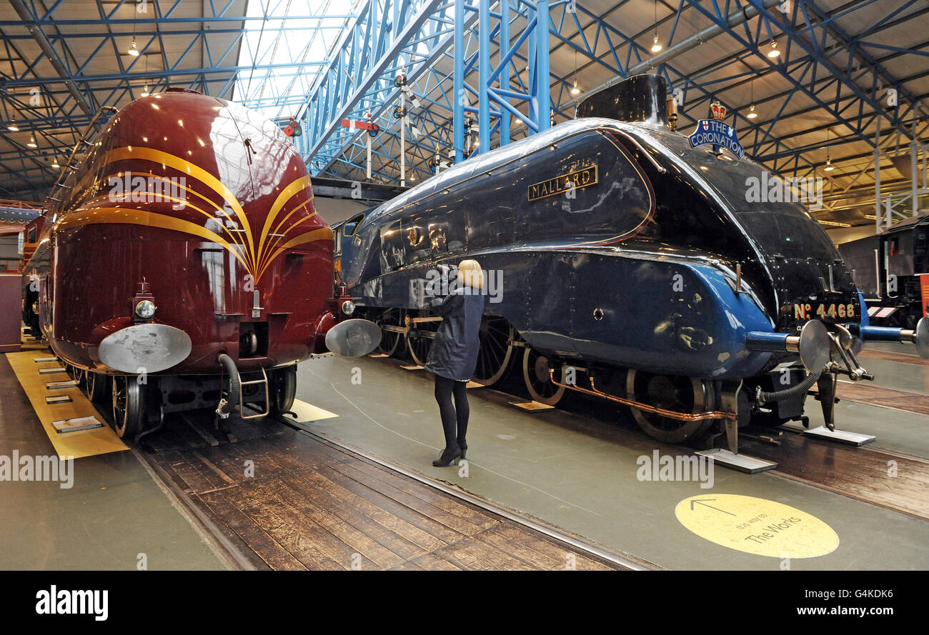A visitor takes a photograph of the Duchess of Hamilton locomotive ...