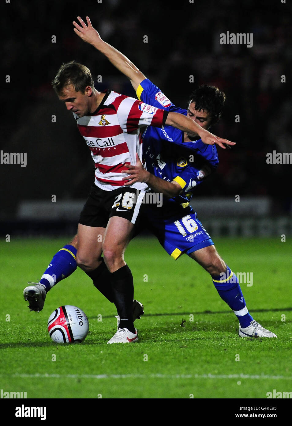 Doncaster Rovers' James Coppinger (left) and Leeds United's Danny Pugh ...