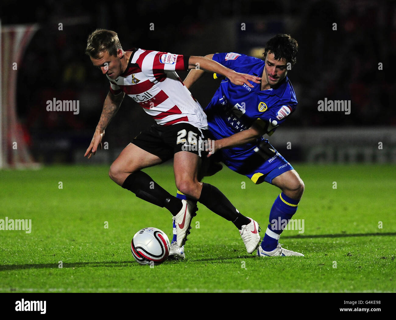 Doncaster Rovers' James Coppinger (left) and Leeds United's Danny Pugh ...