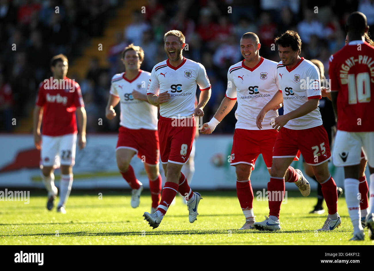 Stacy Long (centre) celebrates scoring his sides opening goal during ...
