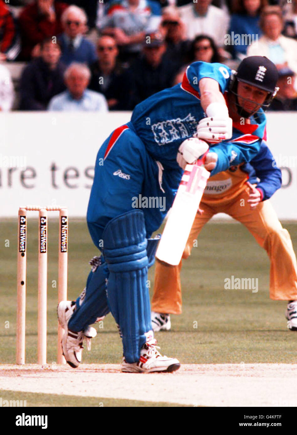 Englands Nick Knight hits one run of Essex bowler Ashley Cowan during ...