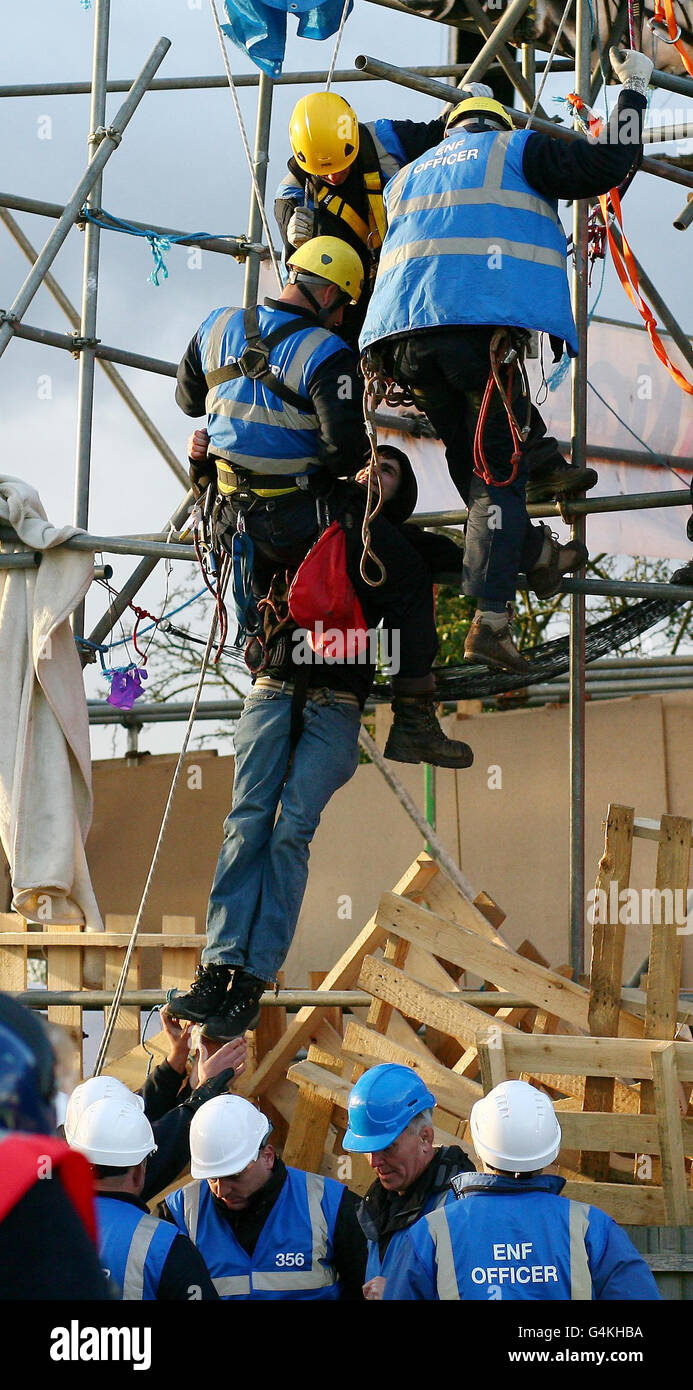 Bailiffs remove a farm activist from the tower at the entrance to Dale ...
