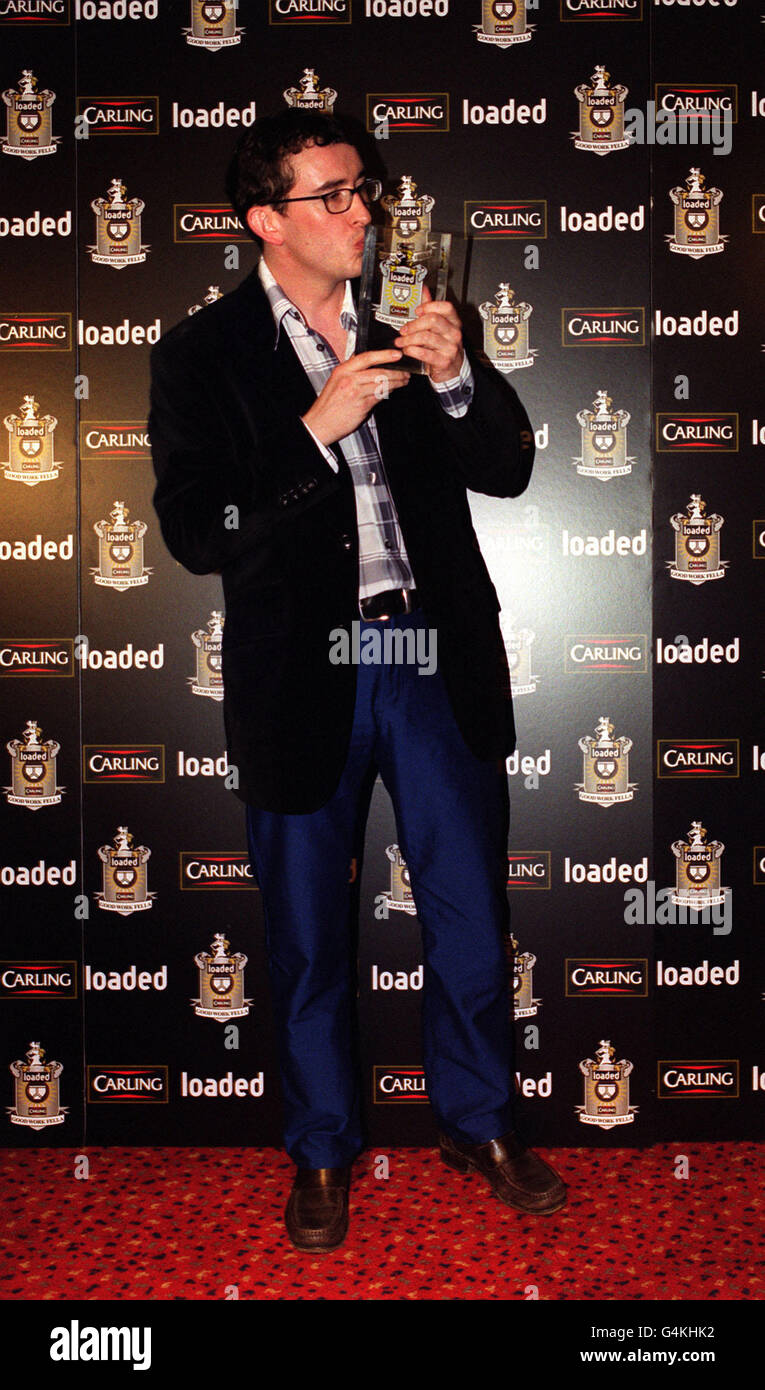 Comedian Steve Coogan kisses his Best British Comedian award, at the ...