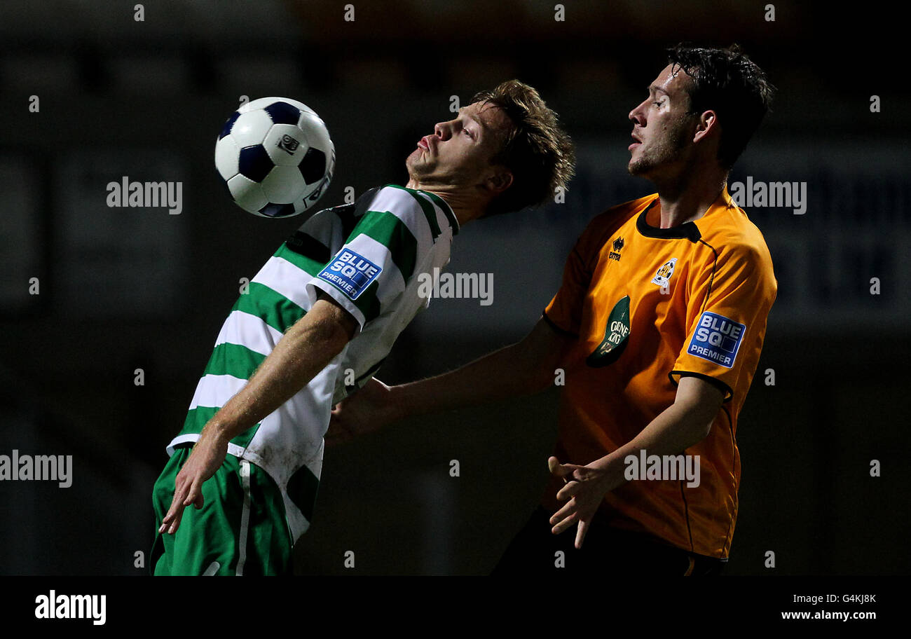 Lincoln City's and Adam Watts (left) controls the ball Stock Photo - Alamy