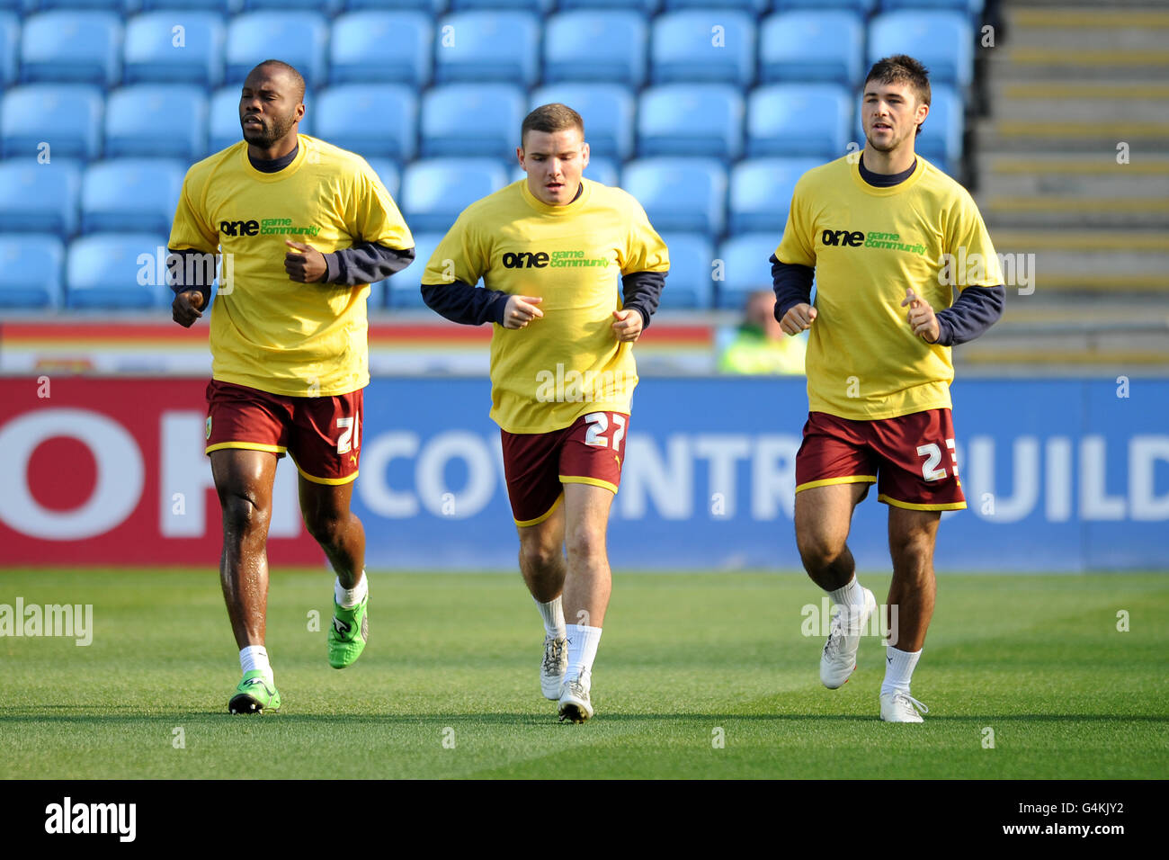 Burnley's Andre Amougou (left), Alexander MacDonald and Charlie Austin ...